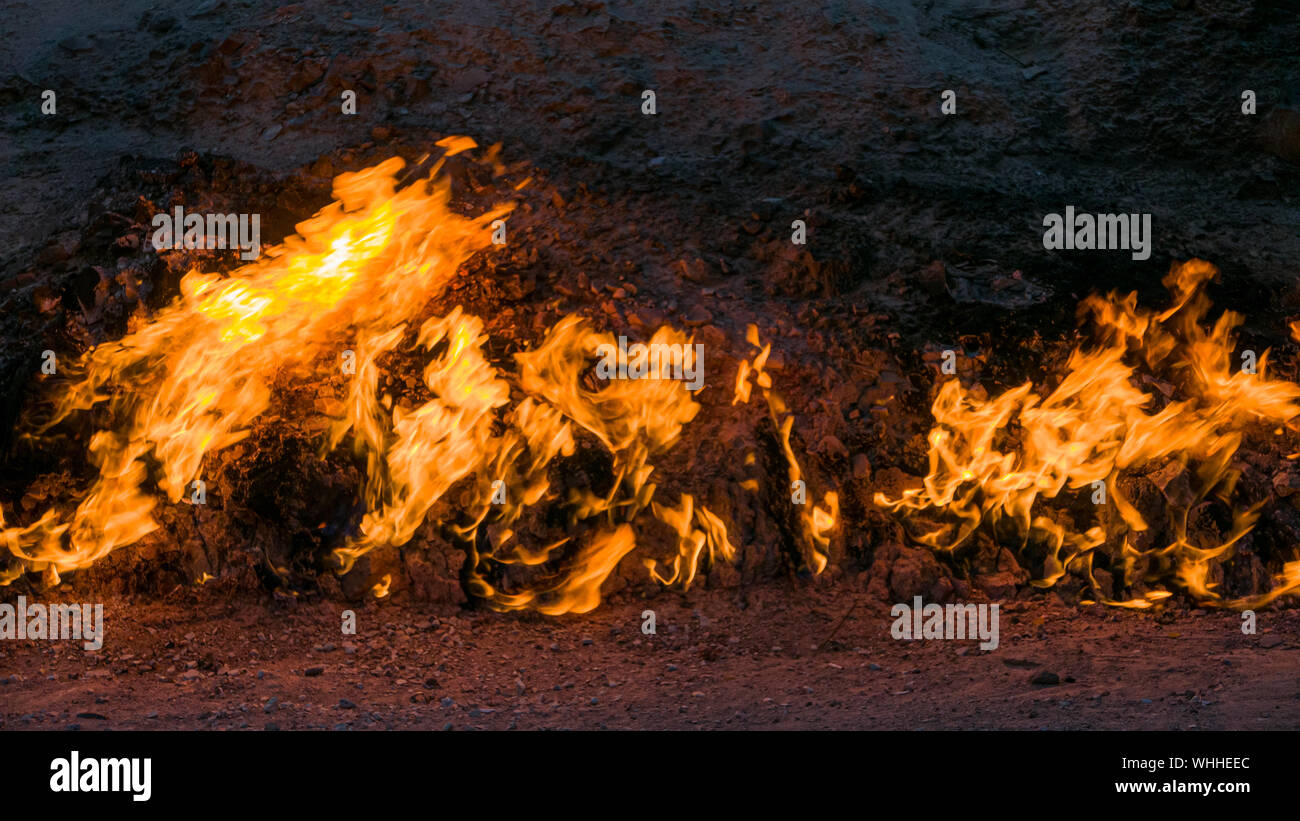 Burning soil, natural gas heating the ground Stock Photo - Alamy