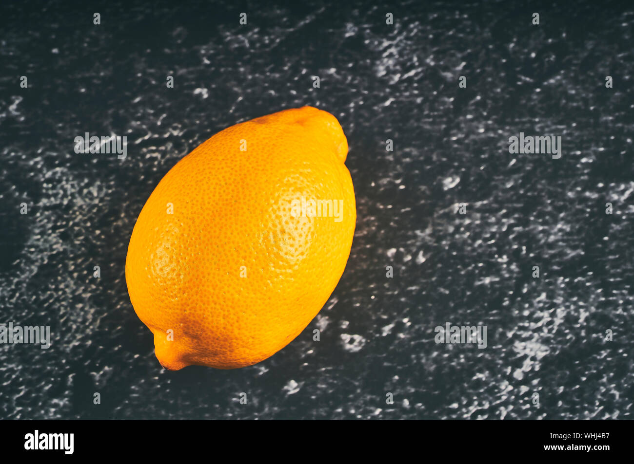 Fresh lemon isolated in marble stone Stock Photo - Alamy