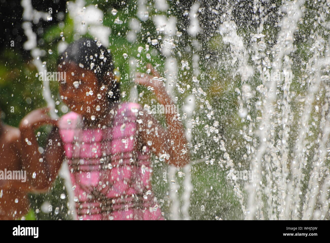 Girl falling into fountain hi-res stock photography and images - Alamy