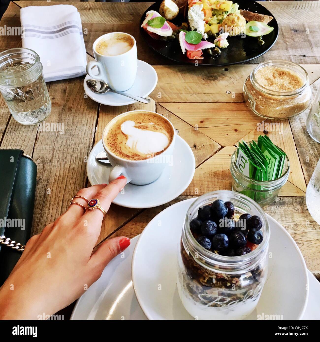 Reaching for coffee cup hi-res stock photography and images - Alamy