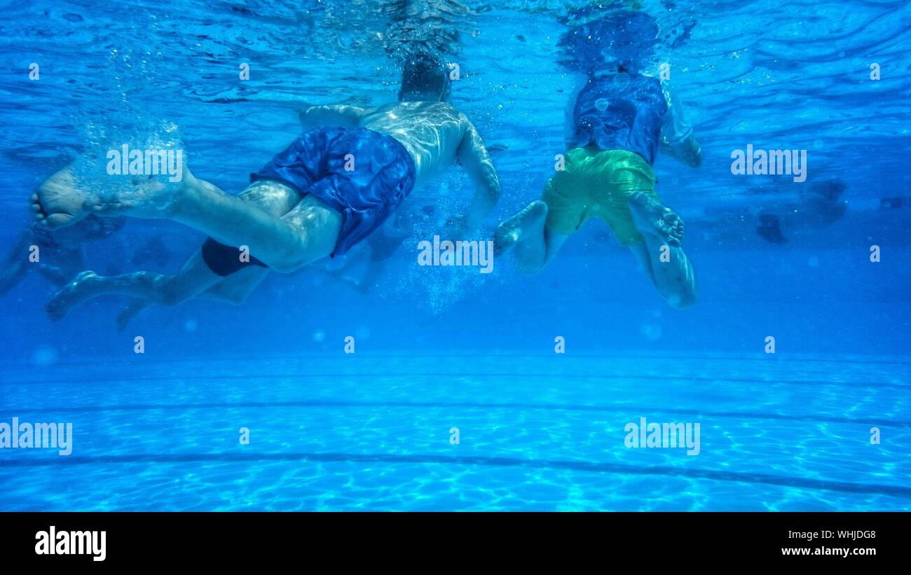 Two boys underwater hi-res stock photography and images - Alamy