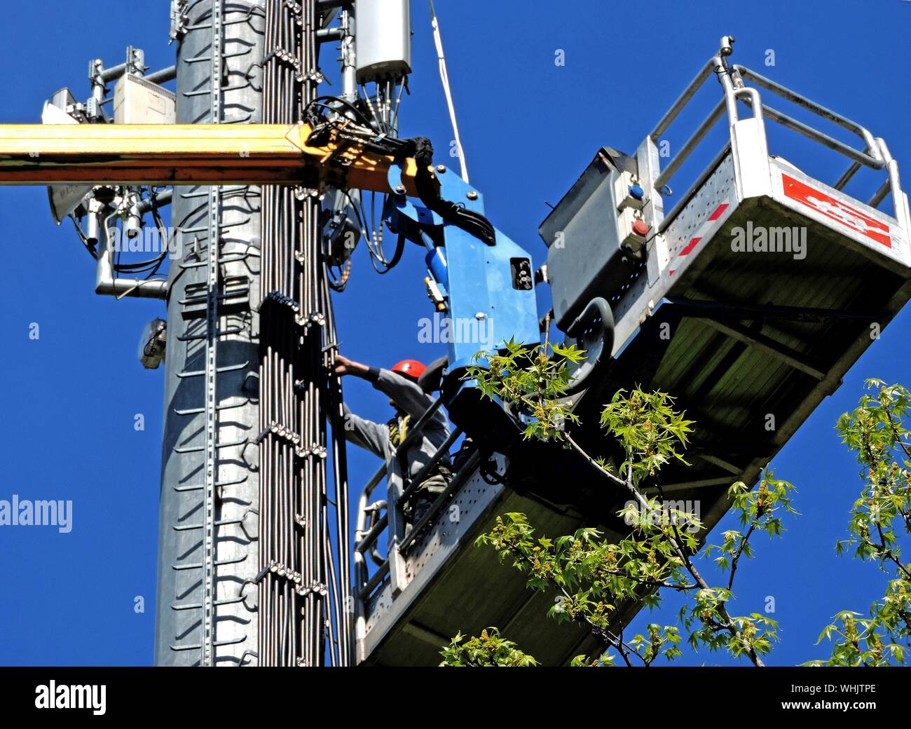 Men working on electricity pylon hi-res stock photography and images ...