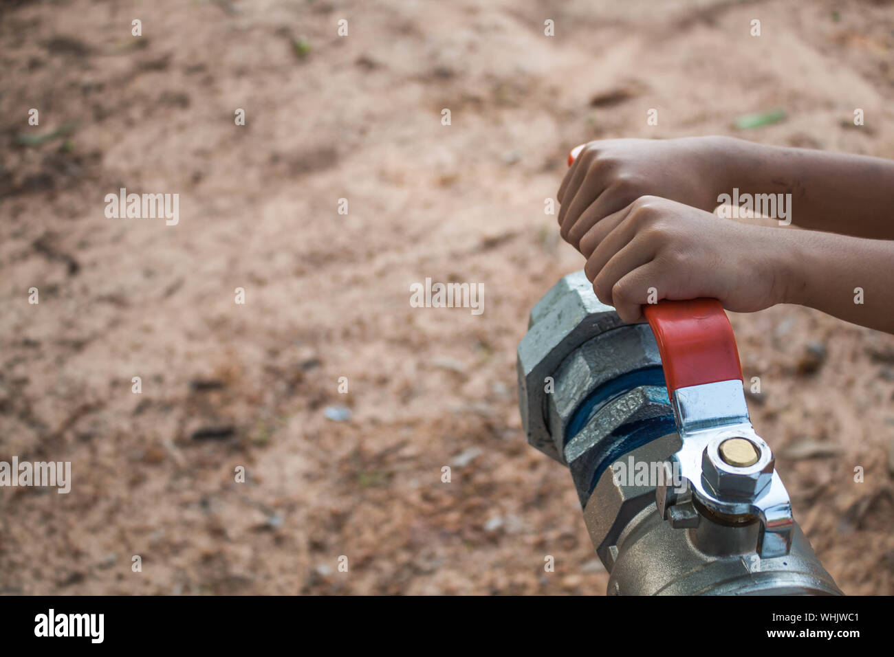 Hands holding pipe hi-res stock photography and images - Alamy