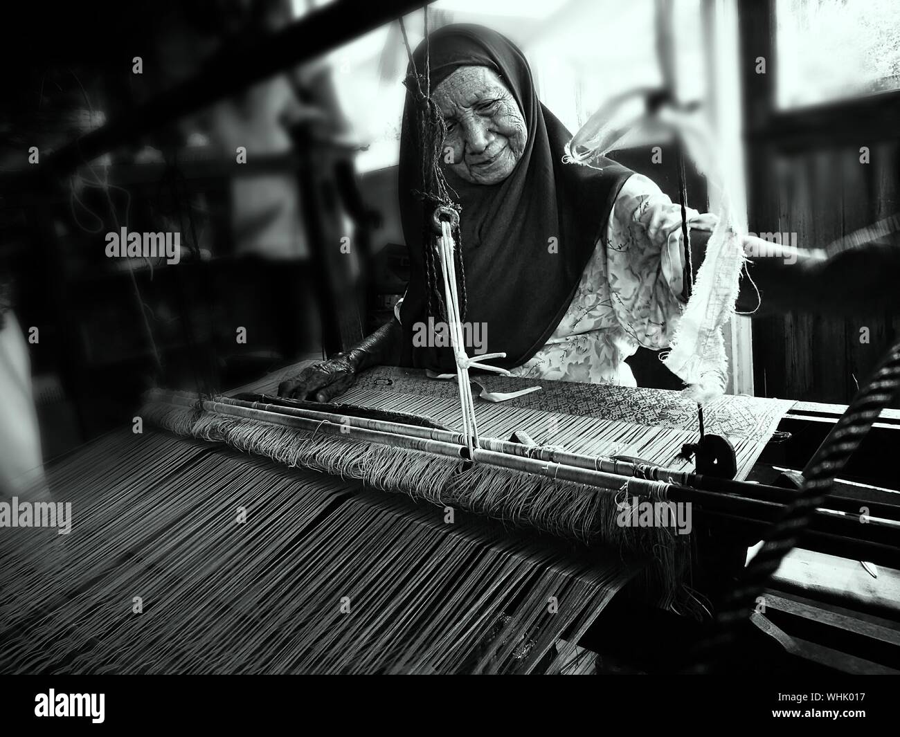 Woman at loom hi-res stock photography and images - Alamy