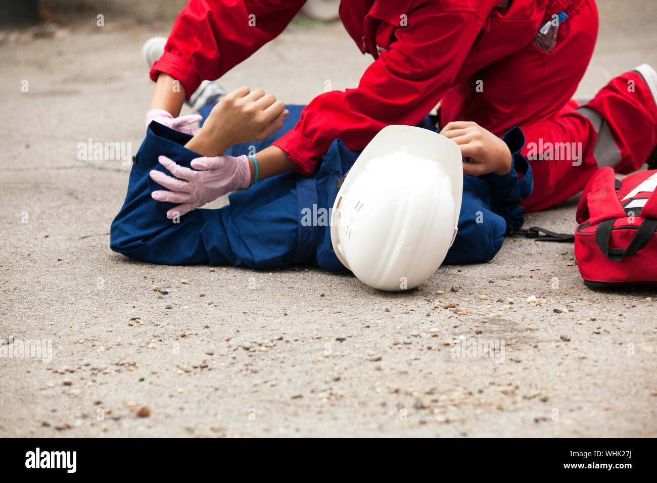 Paramedic Performing Cpr On Person Lying On Street Stock Photo - Alamy