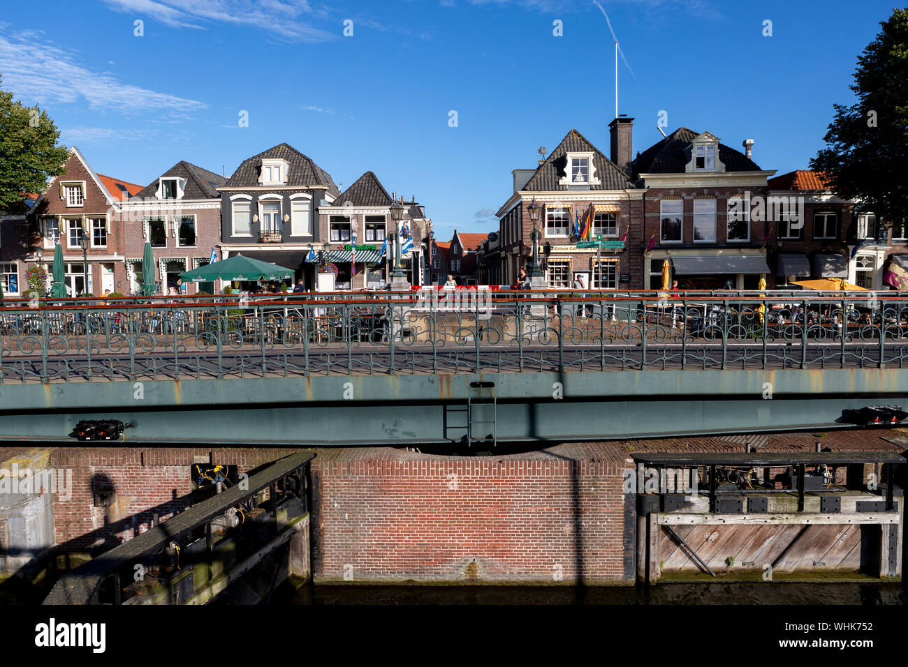 Opened rotating sluice gate bridge letting boats pass from the harbour ...