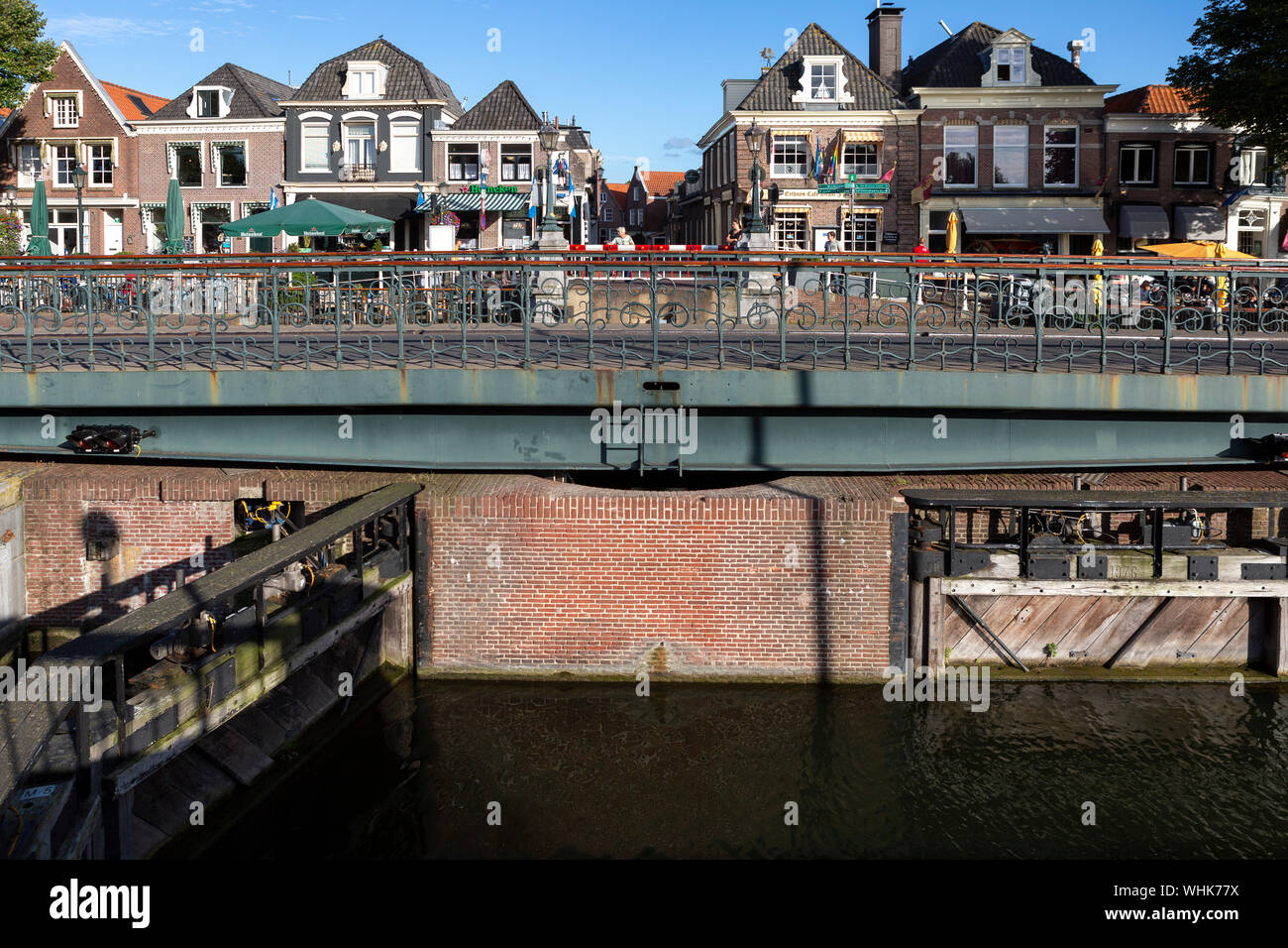 Opened rotating sluice gate bridge letting boats pass from the harbour ...