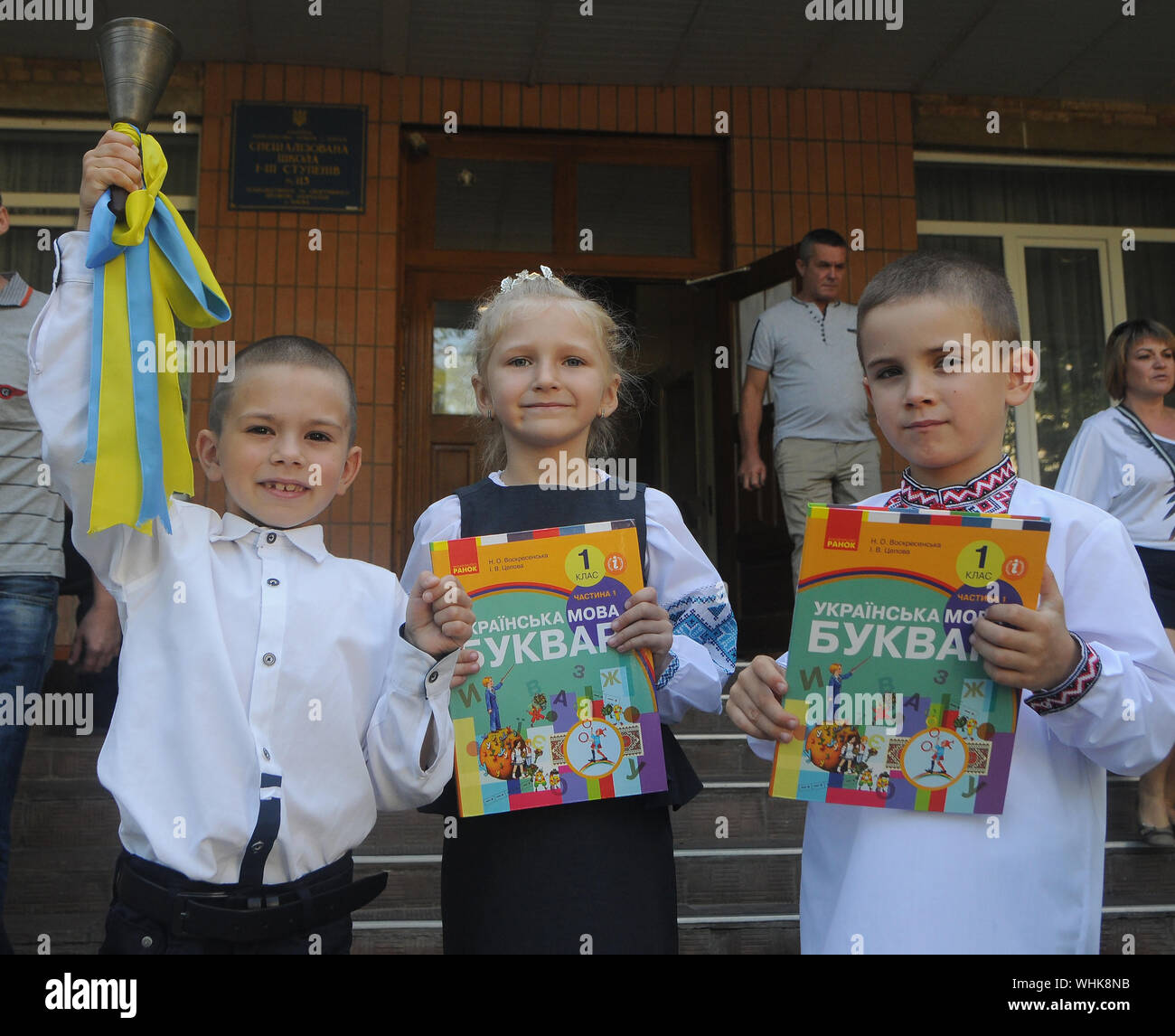 Kiev, Ukraine. 1st Sep, 2019. First-graders hold textbooks, Beginner's ...