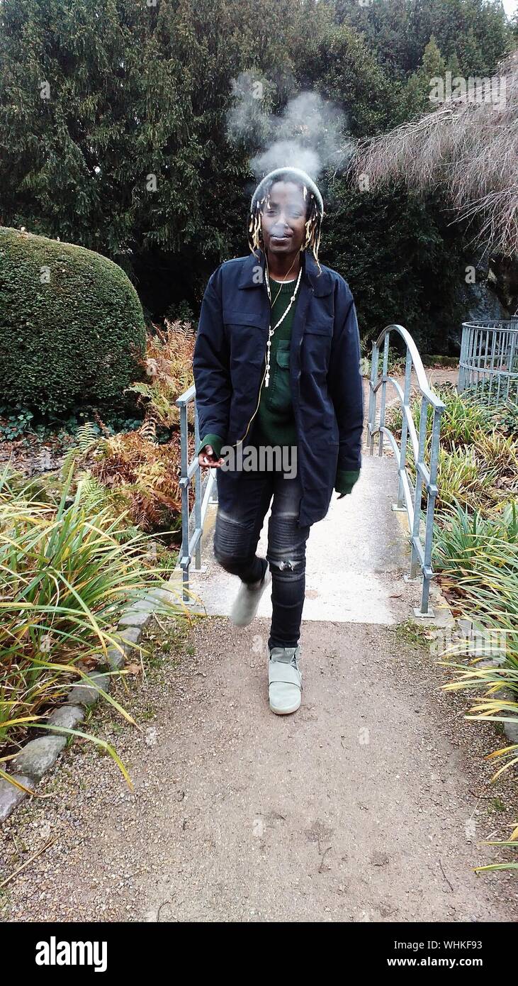 Walking with smoking hi-res stock photography and images - Alamy