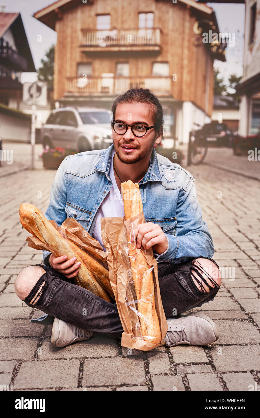 Man eating bread hi-res stock photography and images - Alamy