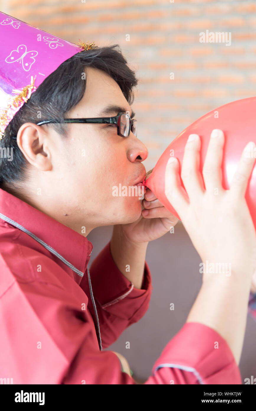 Blowing up balloon hi-res stock photography and images - Alamy