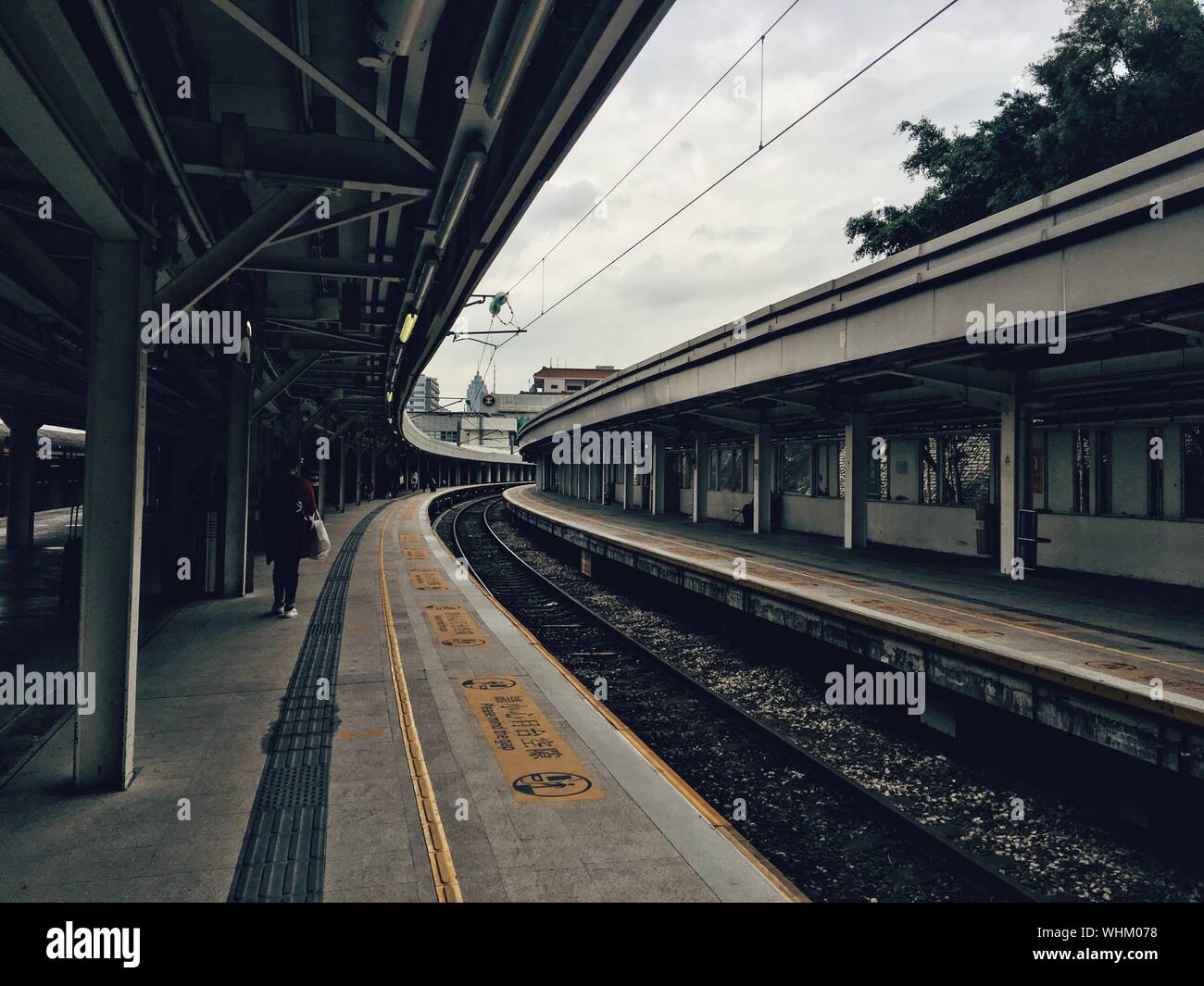 Rear View Of Man Walking On Platform Stock Photo - Alamy