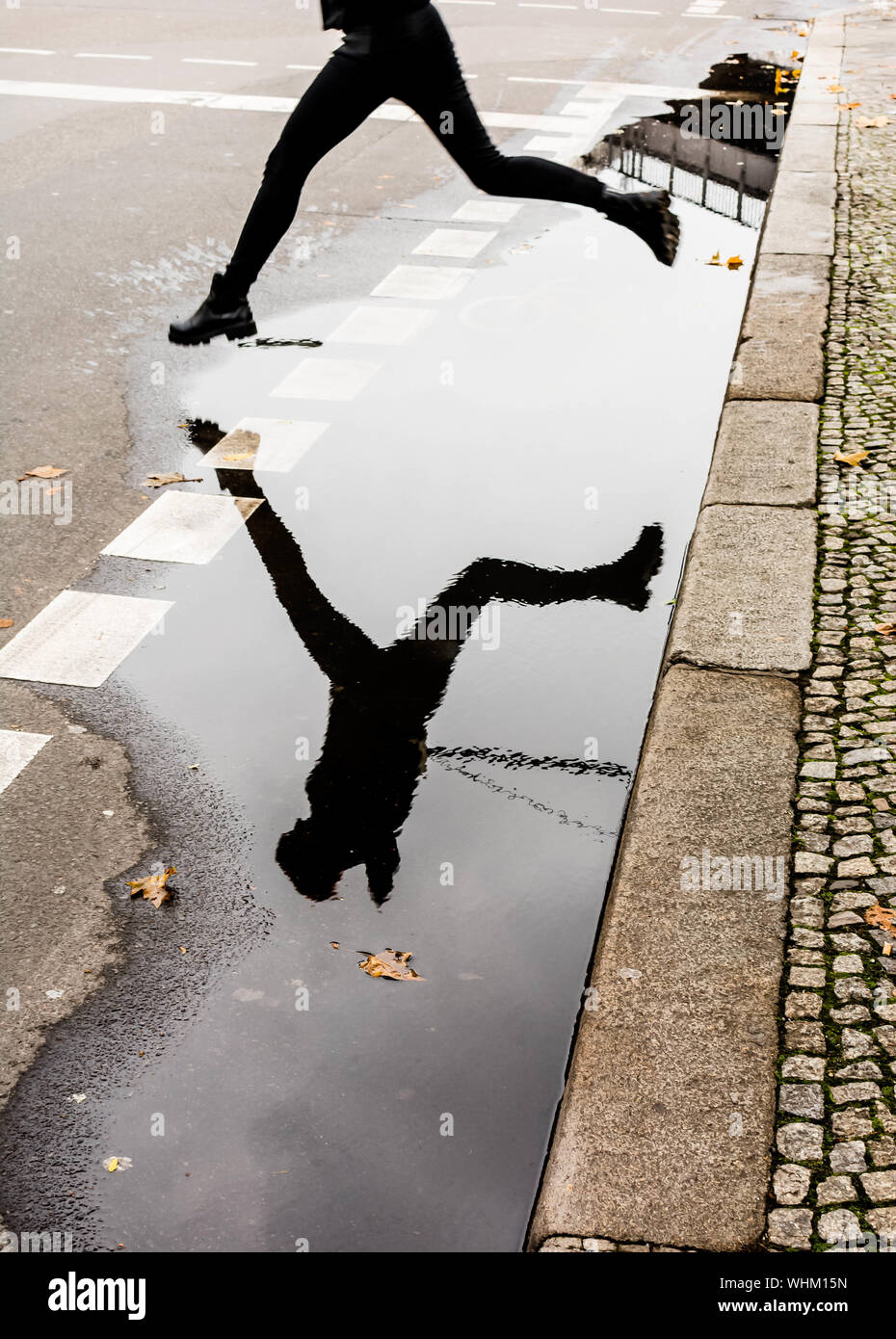 Man jumping puddle hi-res stock photography and images - Alamy
