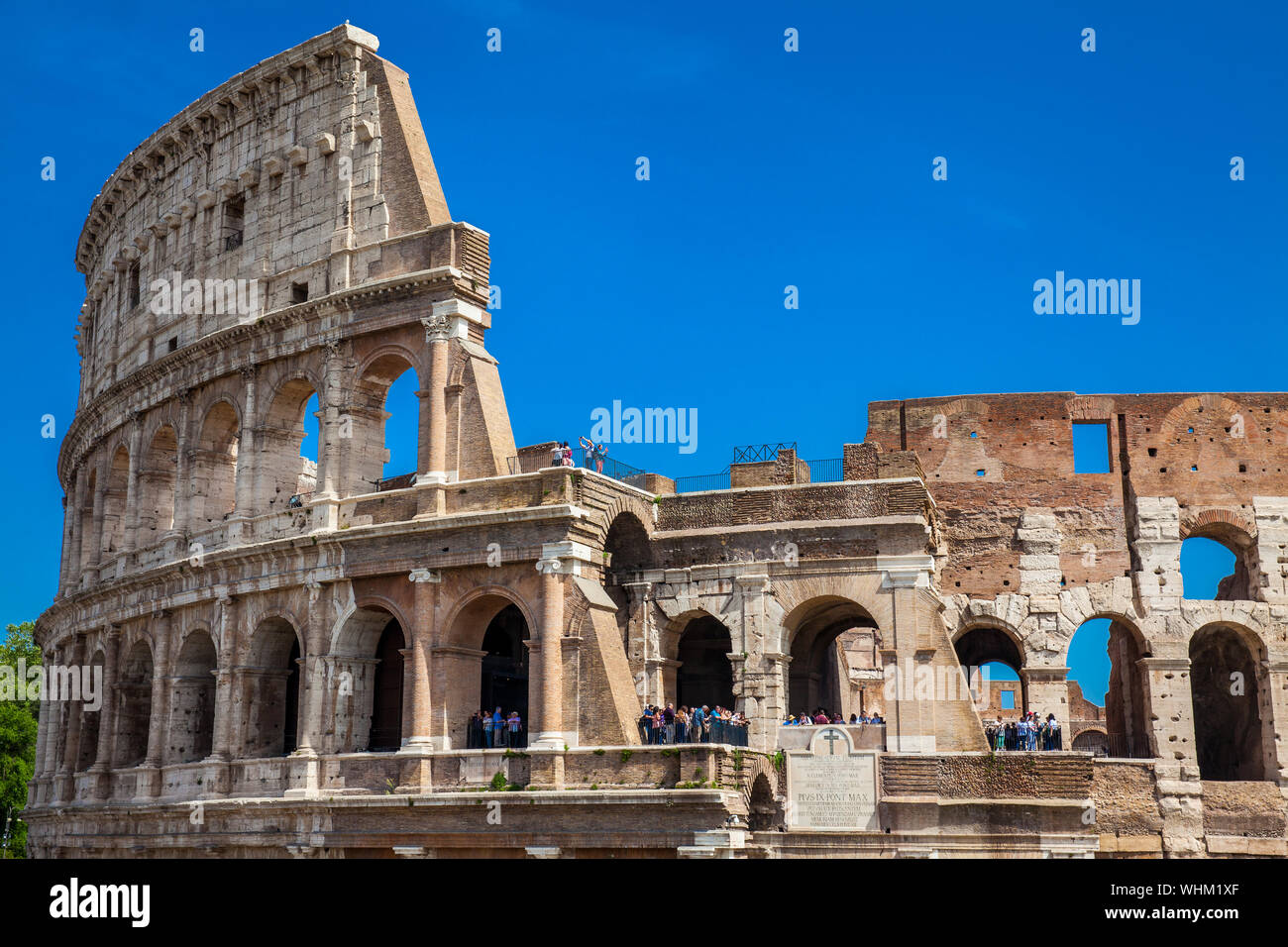 ROME, ITALY - APRIL, 2018: Tourists visiting the famous Colosseum in ...