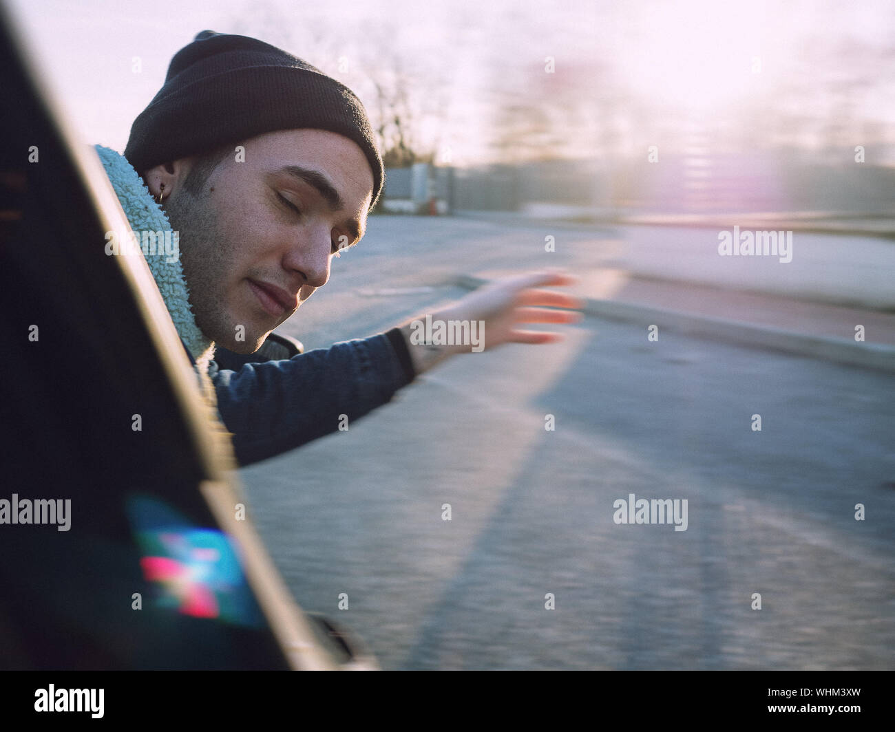 Man leaning out window hi-res stock photography and images - Alamy