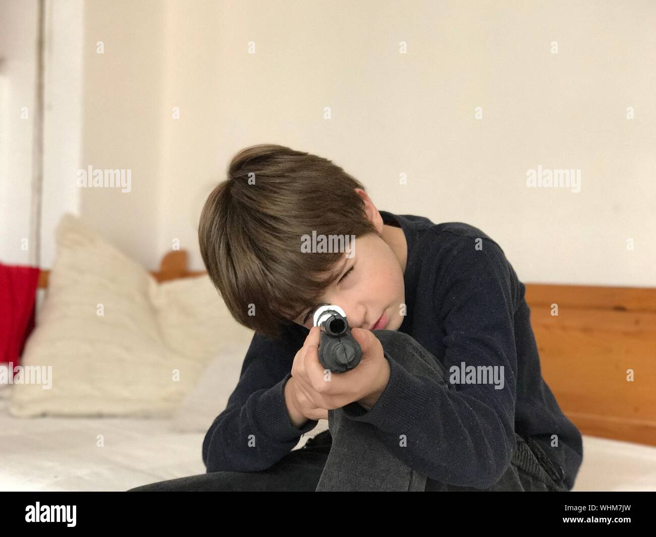 Child with handgun hi-res stock photography and images - Alamy