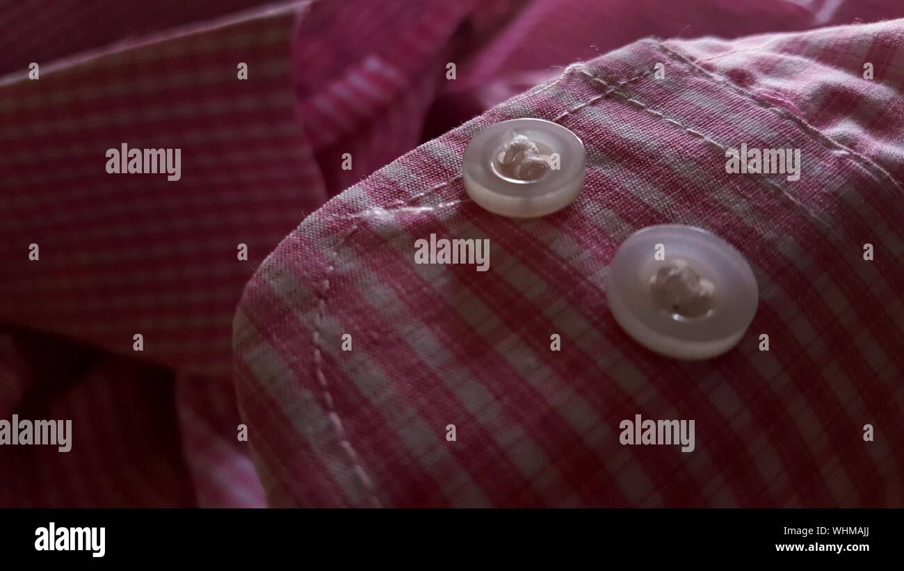 Shirt buttons hi-res stock photography and images - Alamy