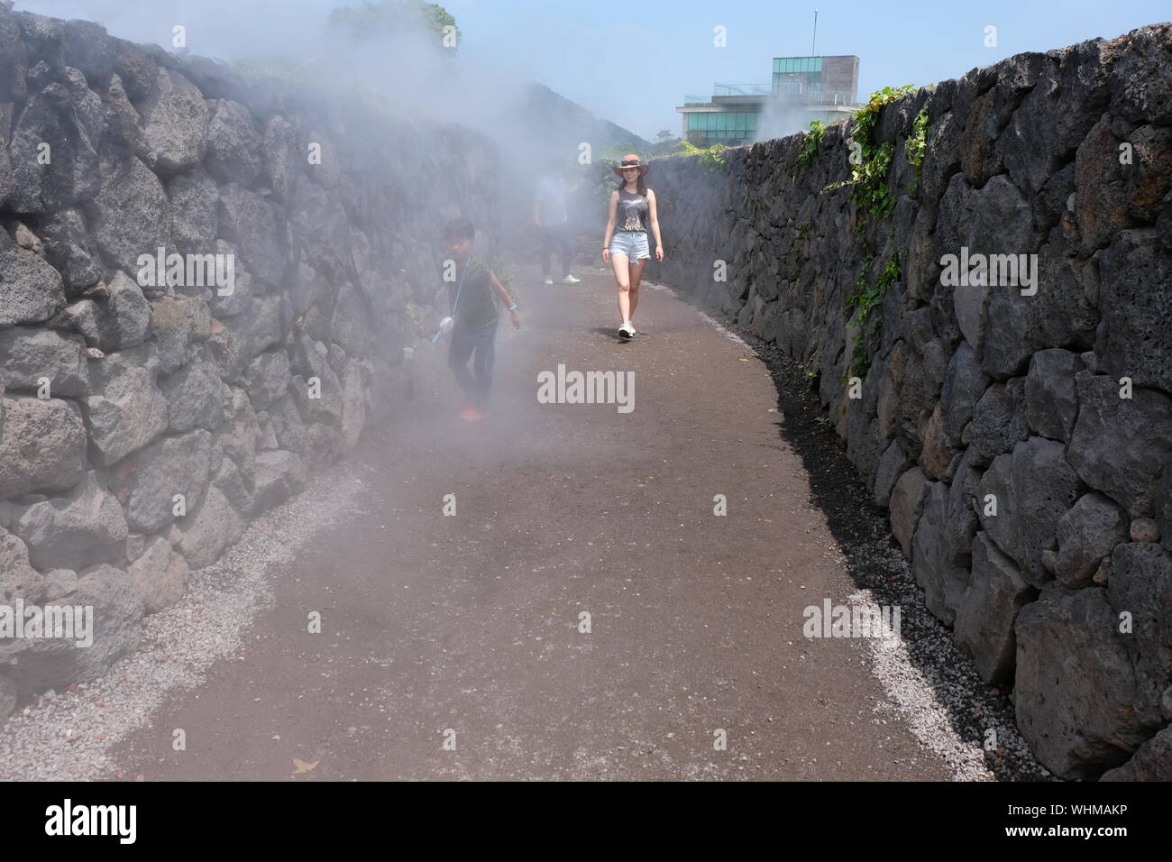 People walking stone wall hi-res stock photography and images - Alamy