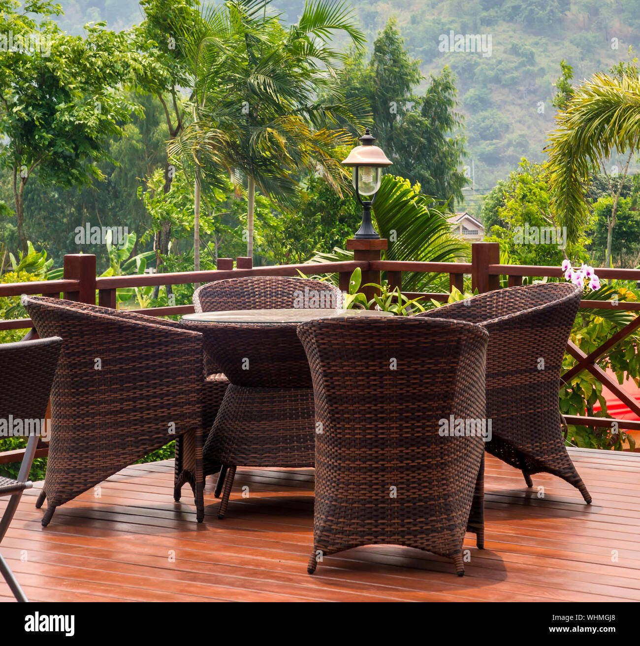 Chairs And Table Against Trees Stock Photo - Alamy