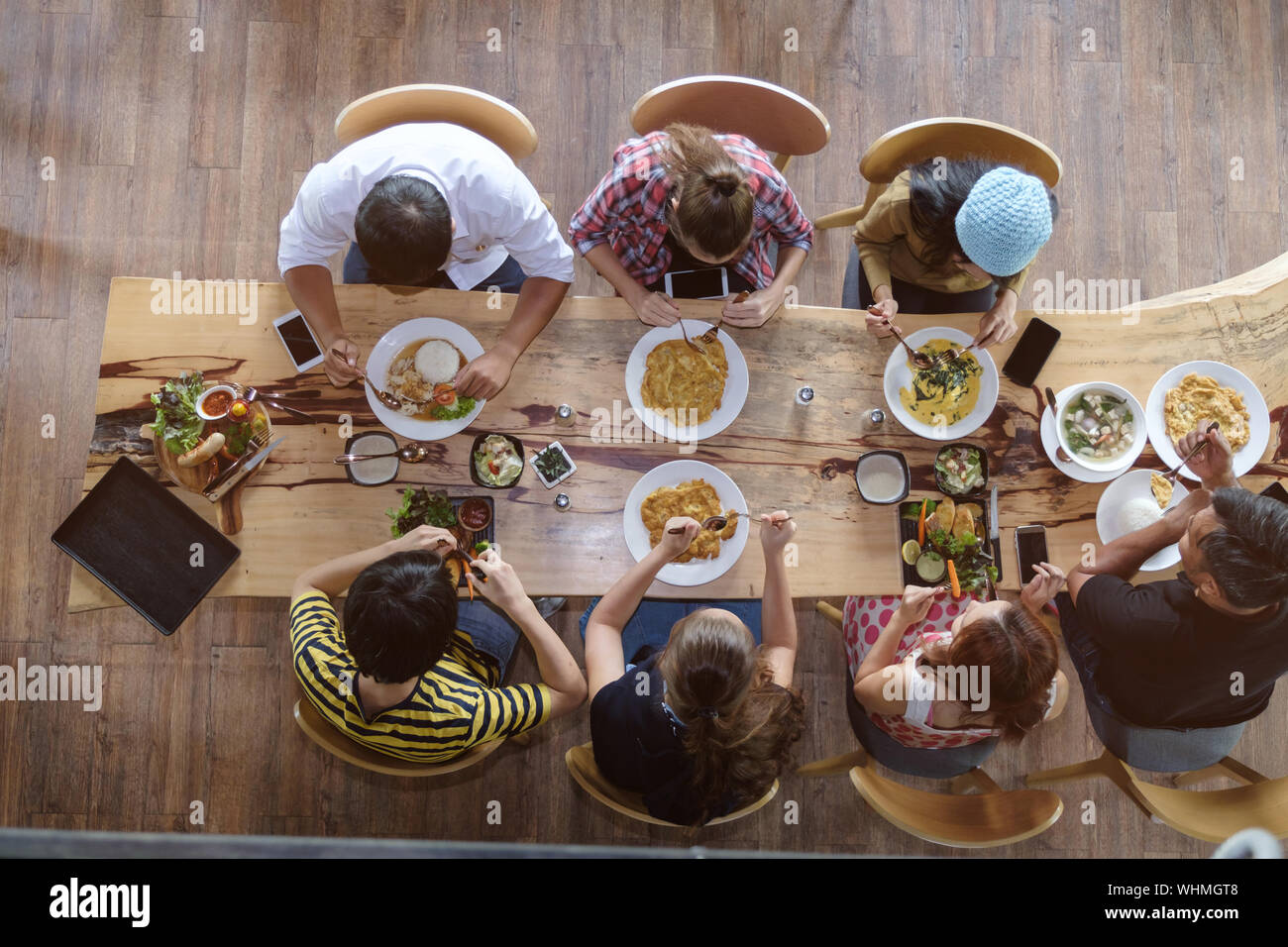 Sitting eating food and drink dining table hi-res stock photography and ...