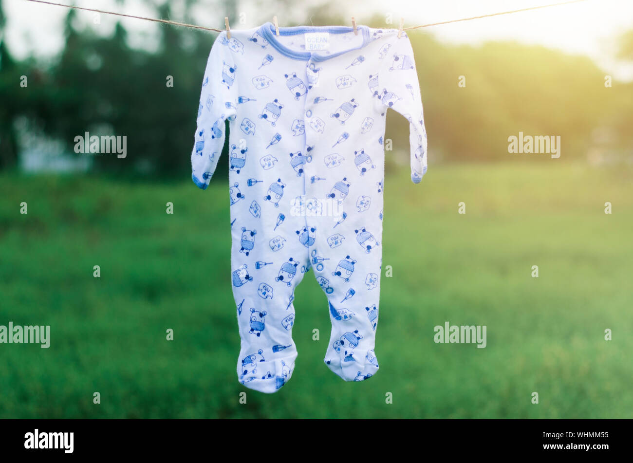 Baby Clothing Hanging On Clothesline Against Landscape Stock Photo Alamy baby-clothing-hanging-on-clothesline-against-landscape-stock-photo-alamy