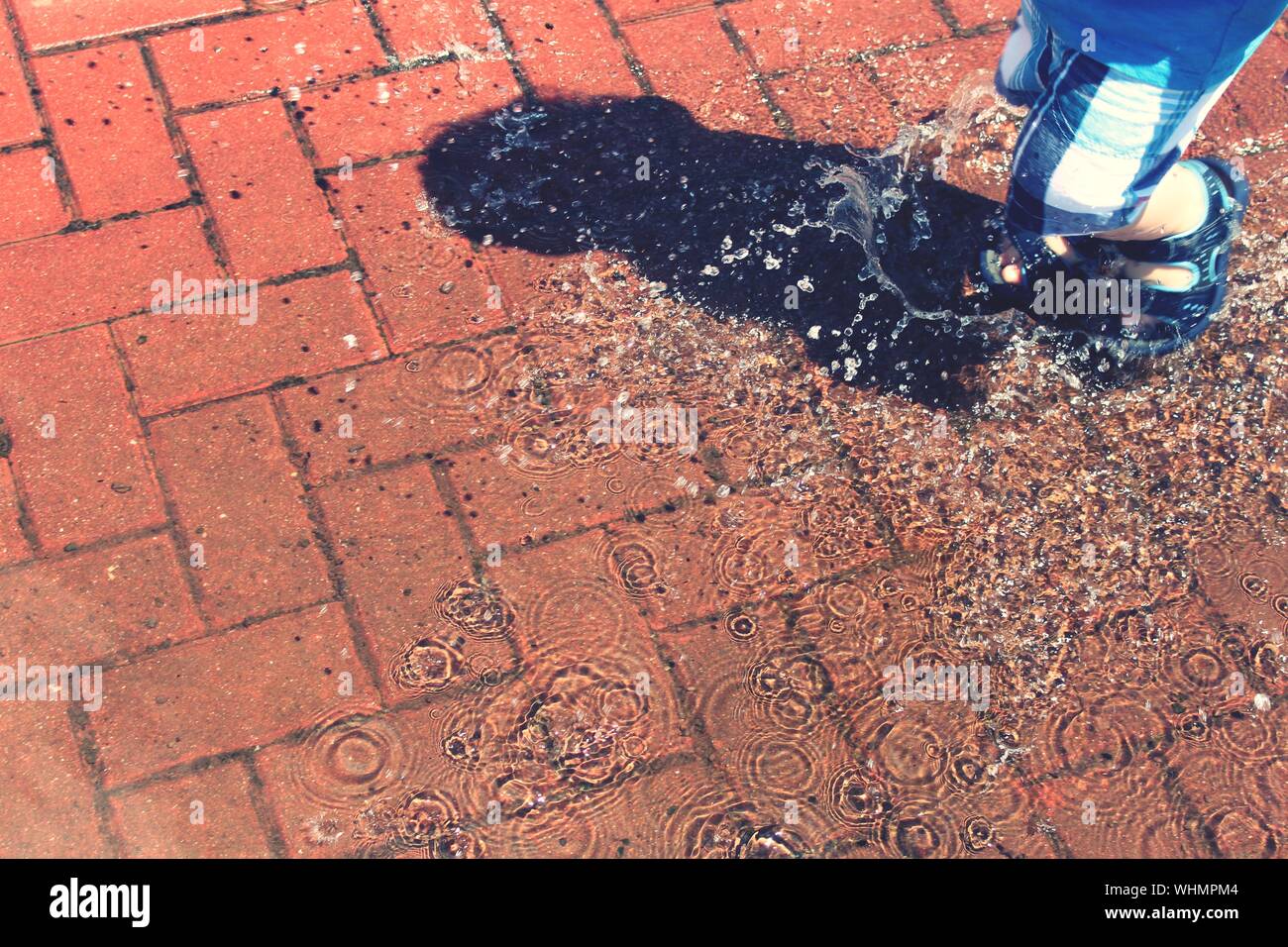 Walking through puddle hi-res stock photography and images - Alamy