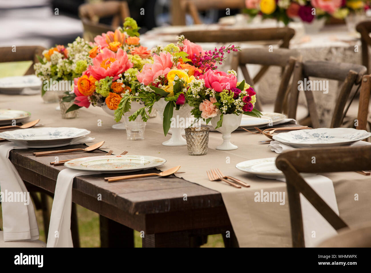 Dinner table with antique dishes and flowers for wedding reception ...