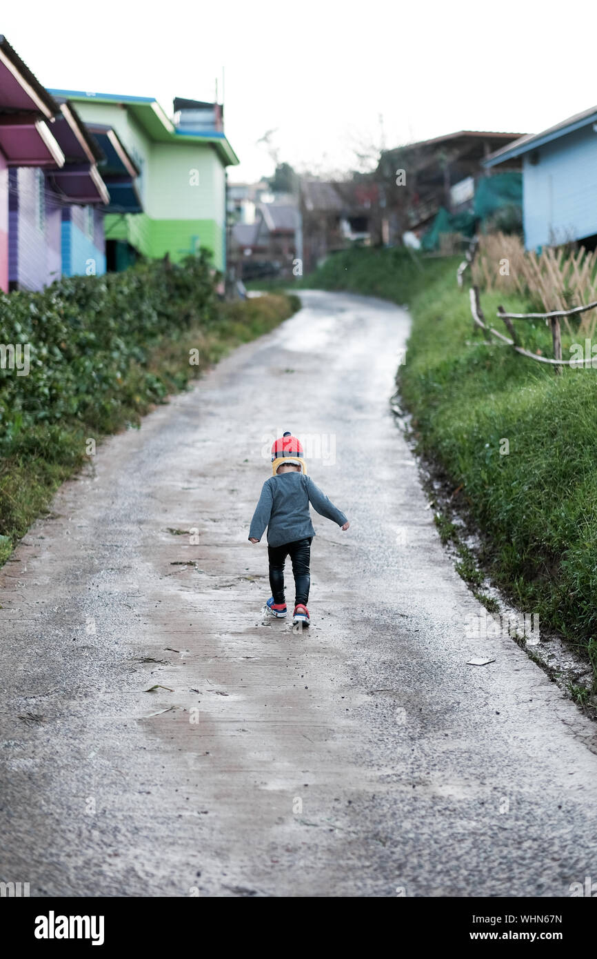 Boys running in the road hi-res stock photography and images - Alamy