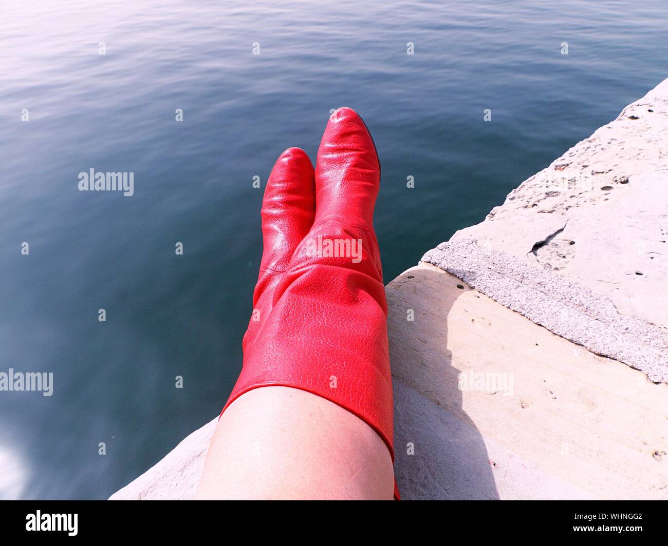 Woman in red boots red hi-res stock photography and images - Alamy