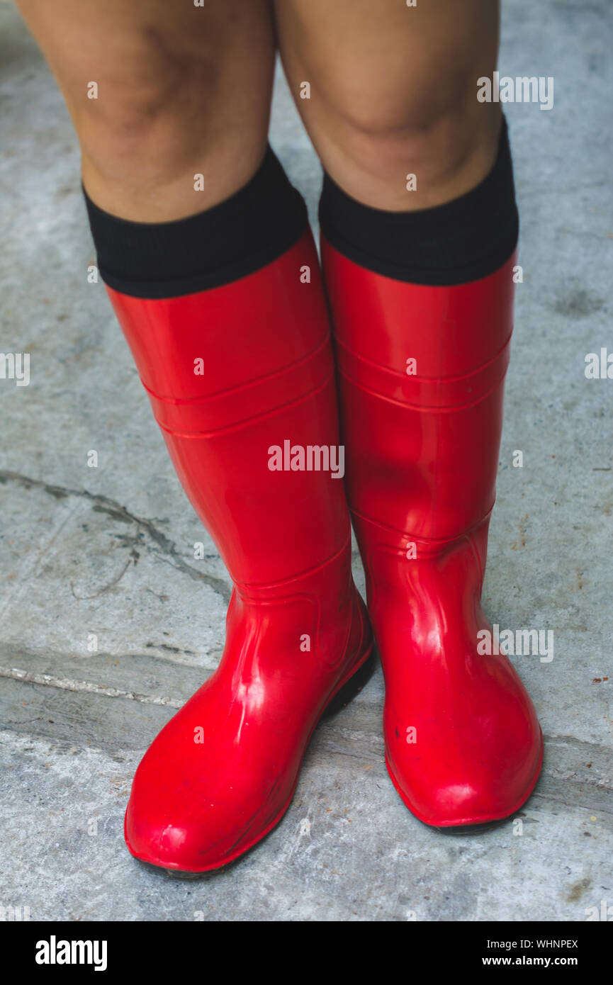 Red rubber boots hi-res stock photography and images - Alamy