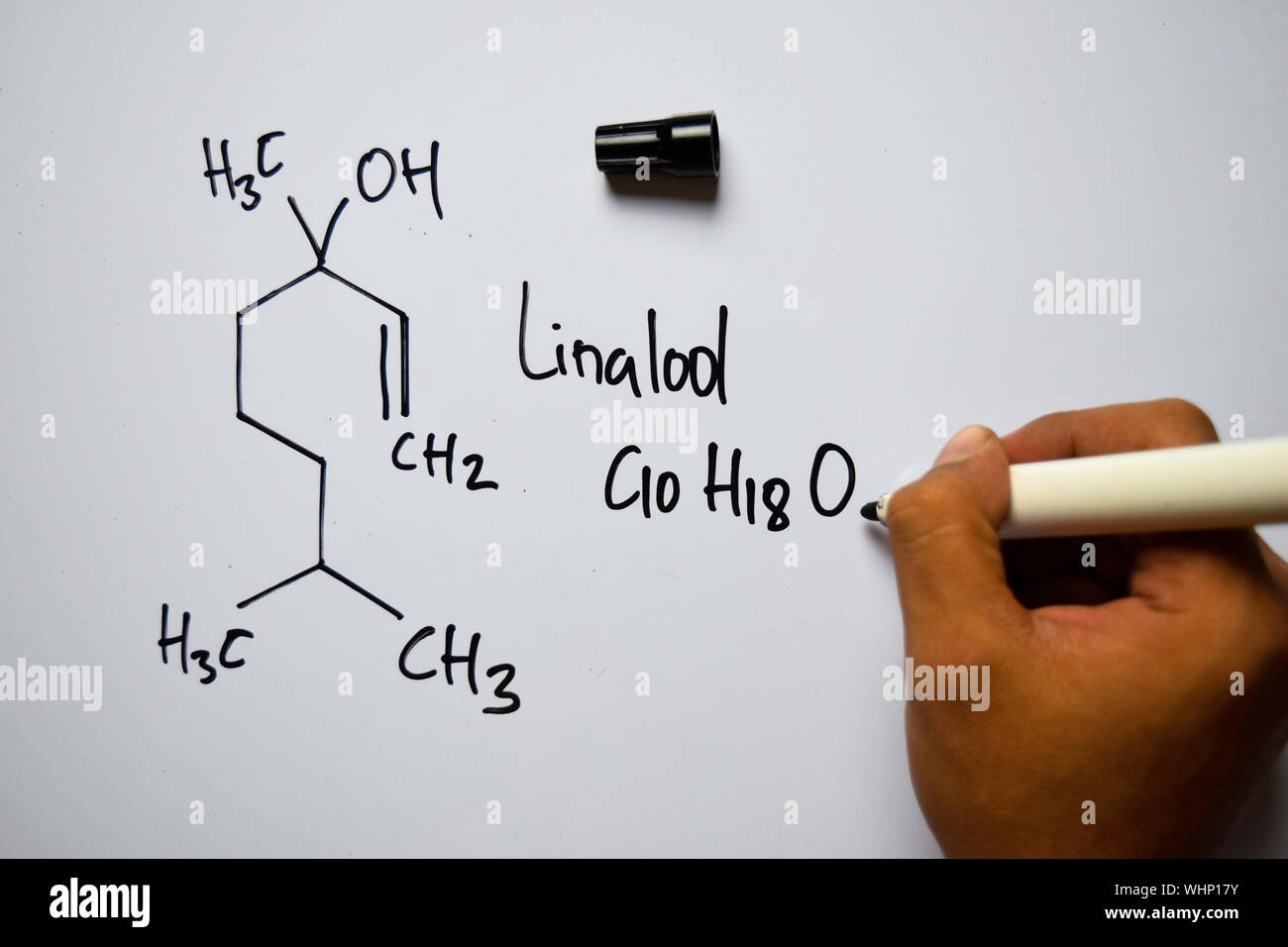 Linalool (C10,H18,O) molecule written on the white board. Structural ...