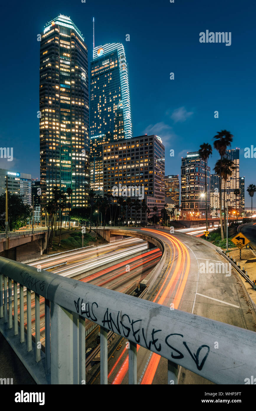 Cityscape skyline view of the 110 Freeway at night in downtown Los ...