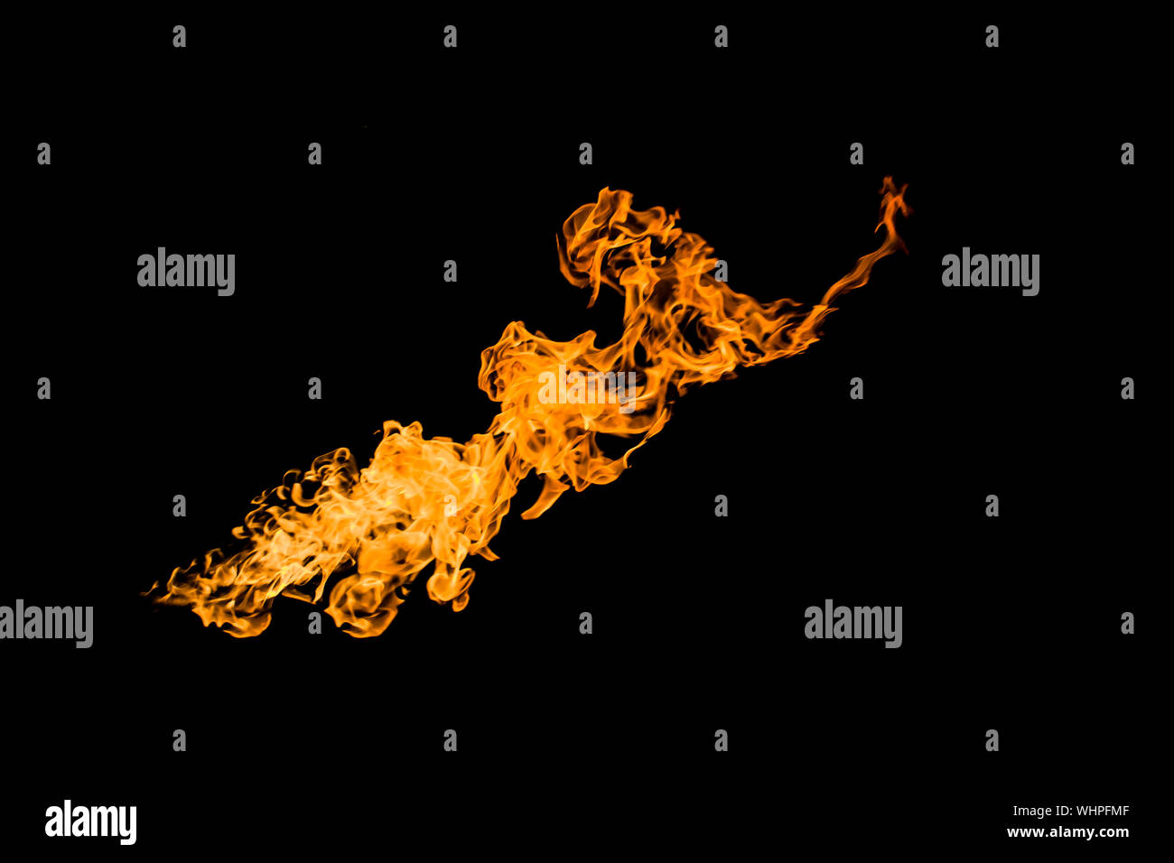 Fire in the shape of a figure with a face. Fire flames on black ...