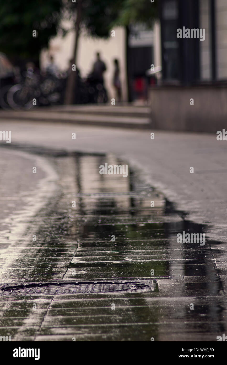 Wet Road In City During Rainy Season Stock Photo - Alamy