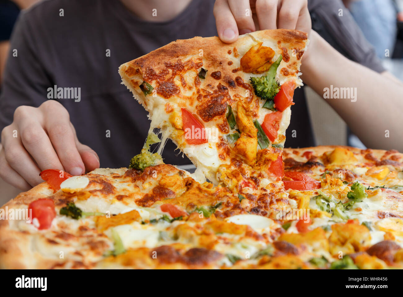 Close up man eating slice of pizza hi-res stock photography and images ...