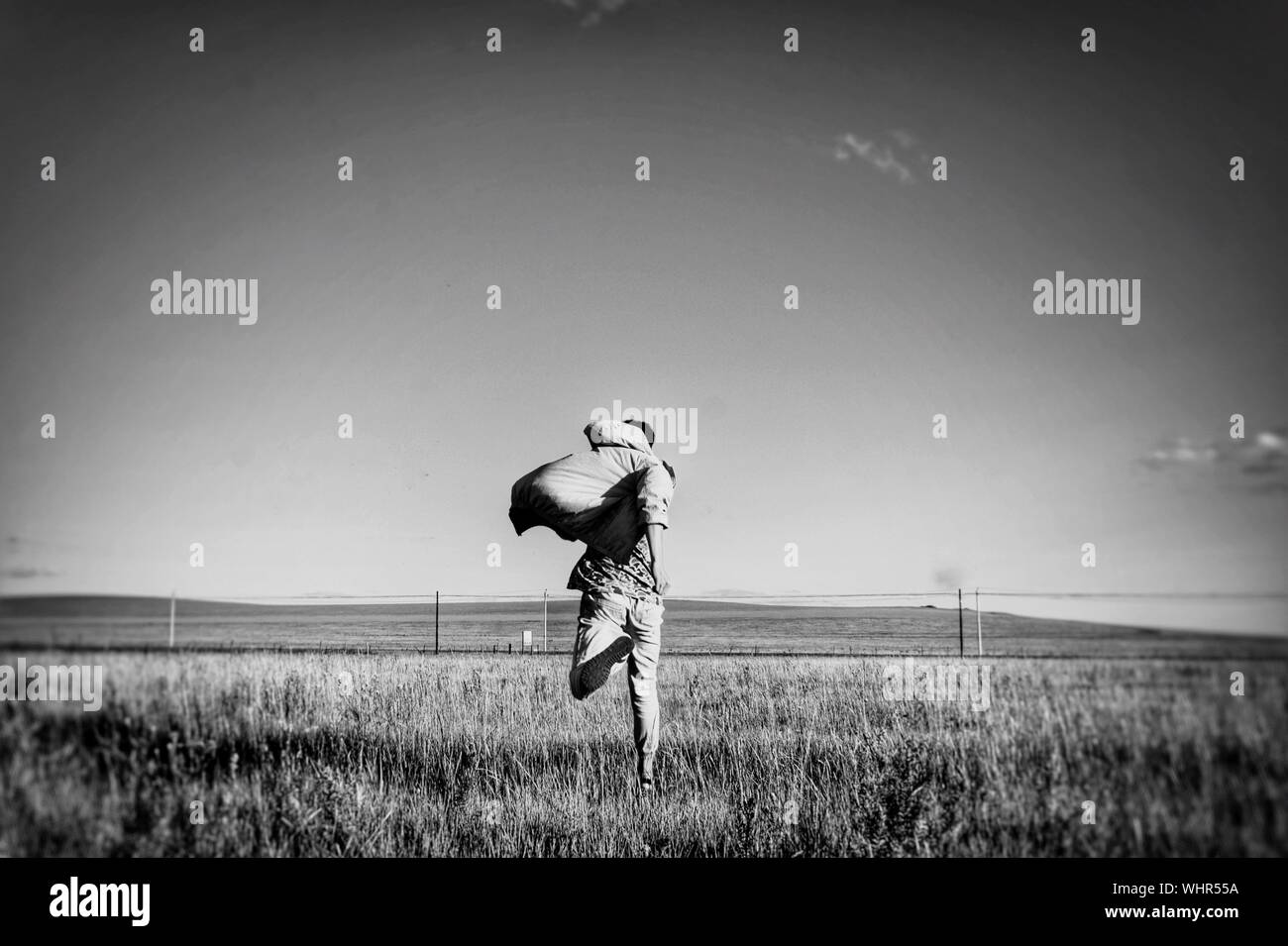 Man running grass hi-res stock photography and images - Alamy