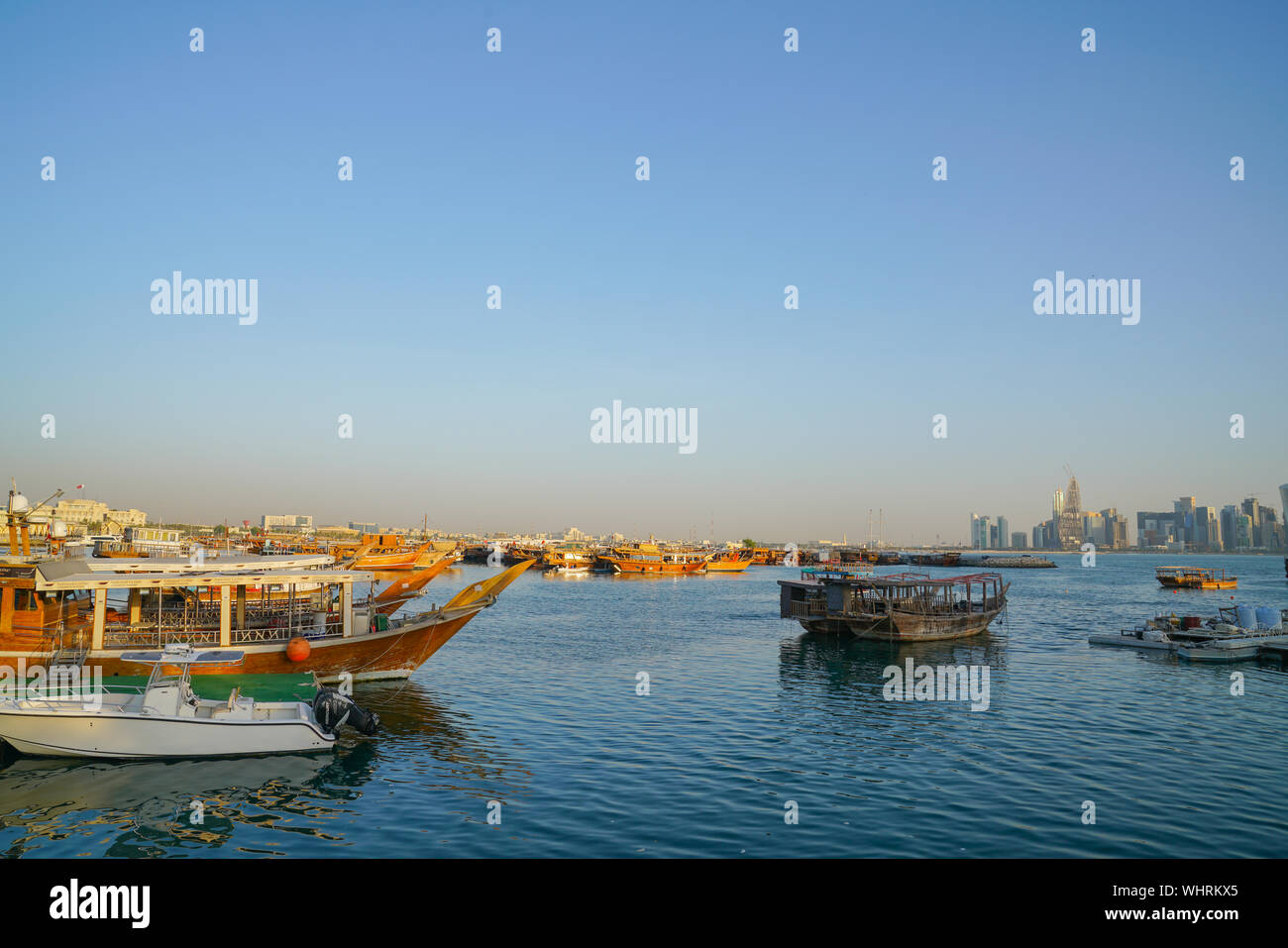 DOHA QATAR - JULY 10 2019; Traditional style dhow boats moored in Dhow ...