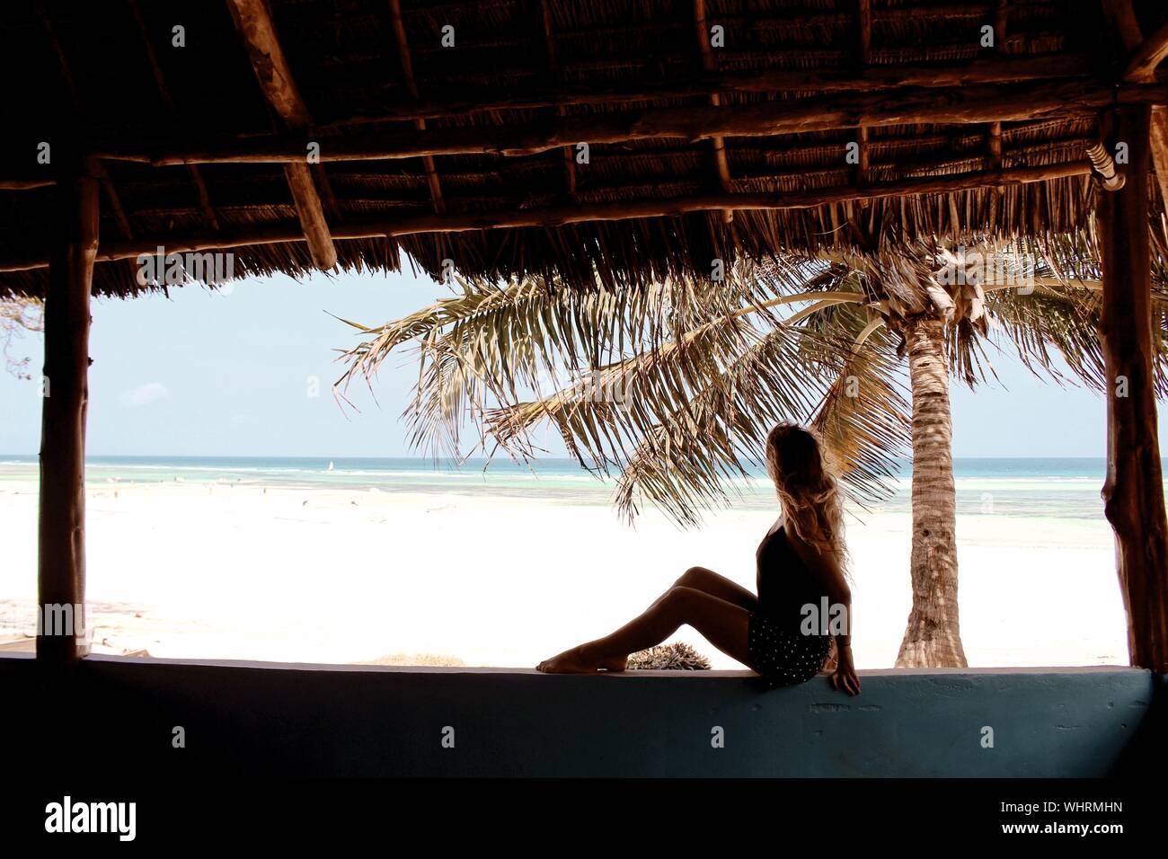 Young woman beach hut hi-res stock photography and images - Alamy