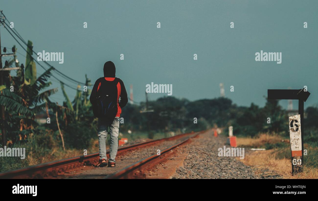 Man walking on railroad tracks hi-res stock photography and images - Alamy