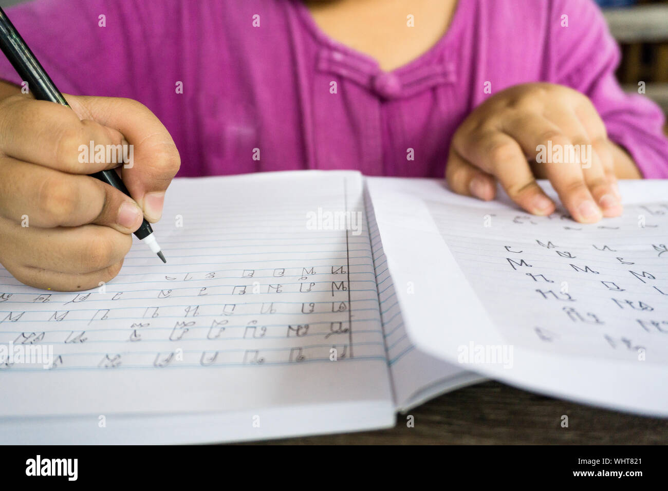 Girl writing with pencil hi-res stock photography and images - Alamy