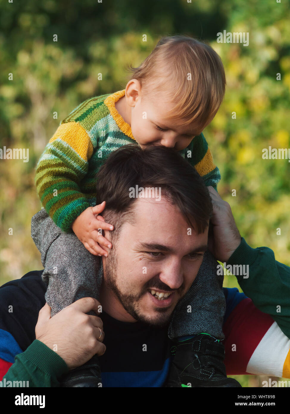 Father carrying baby on shoulder hi-res stock photography and images ...