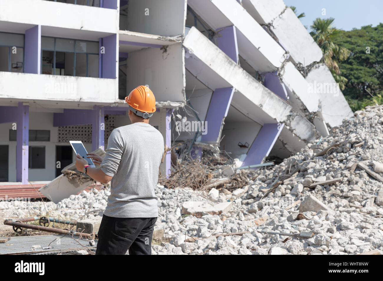 Engineer architect and worker operation control demolish old building ...