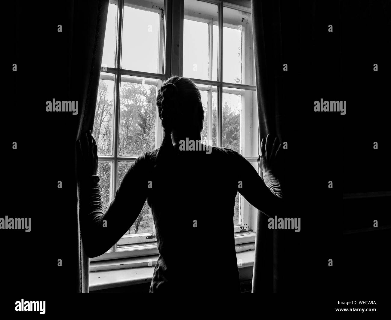 Woman silhouette window rear Black and White Stock Photos & Images - Alamy