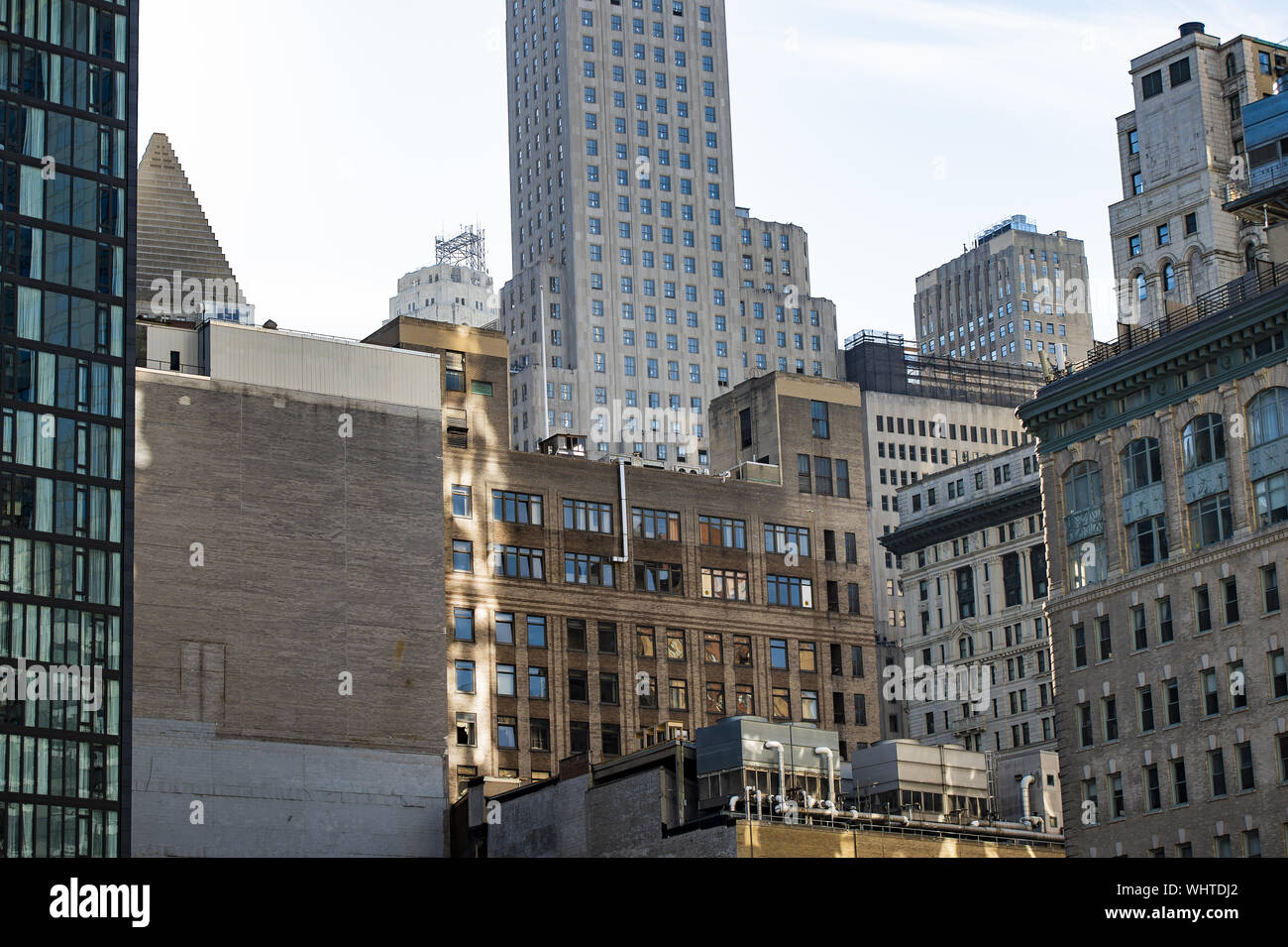 Close-up view of some buildings and skyscrapers during sunset. Downtown ...