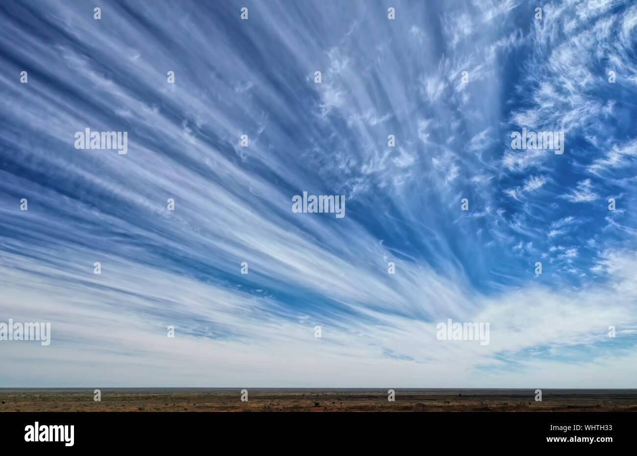 Blue sky with streaky white clouds hi-res stock photography and images ...