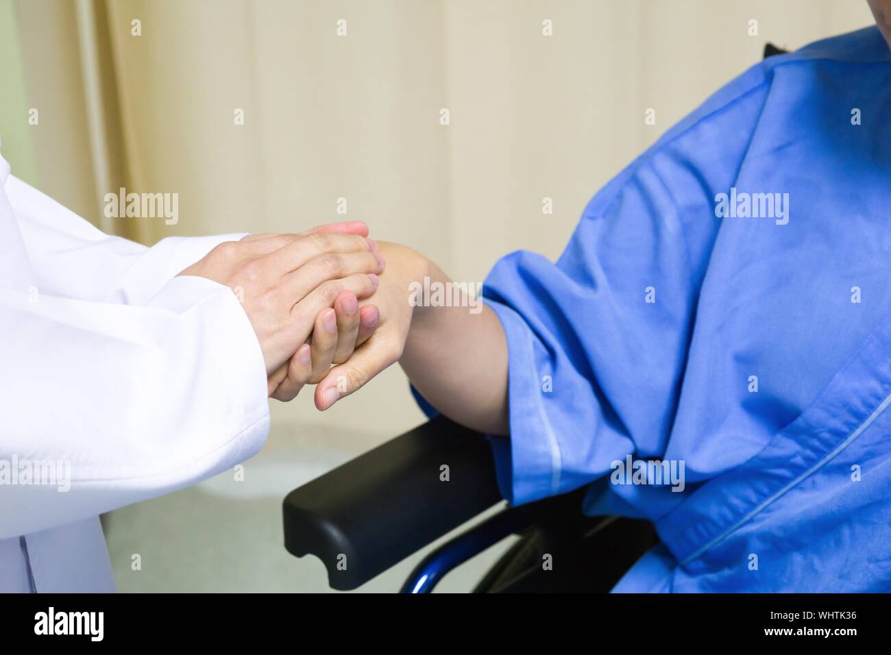 Doctor hand holding patient hand hi-res stock photography and images ...