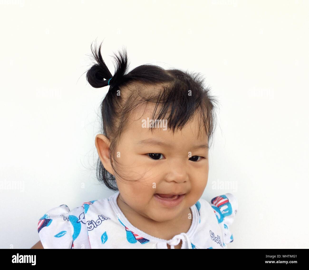 Baby with pigtails hi-res stock photography and images - Alamy