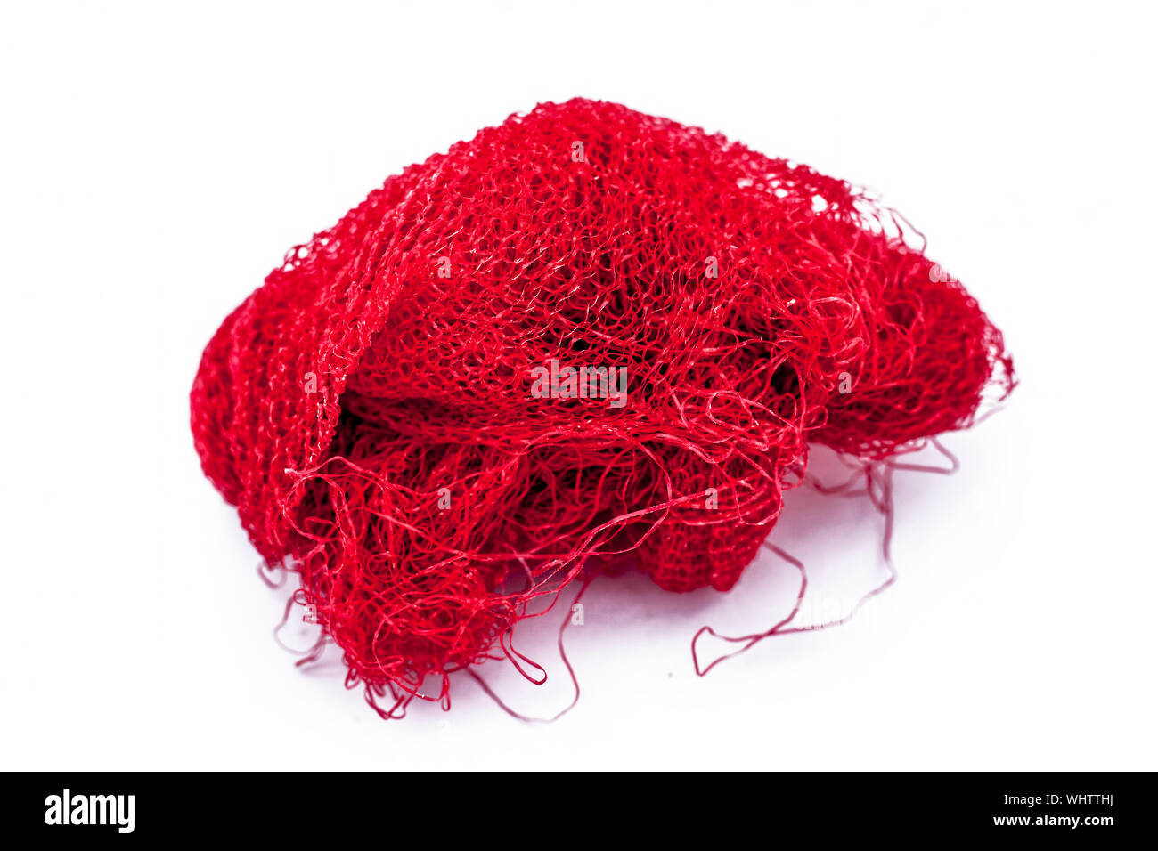 Red colored plastic scrub or scrubber used to clean vessels or utensils ...