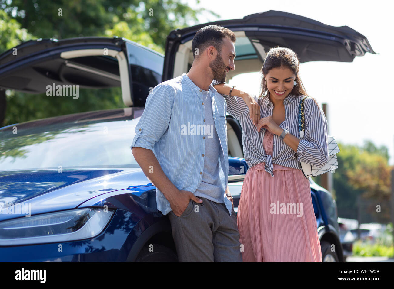 Loving girlfriend smiling while speaking with boyfriend Stock Photo - Alamy