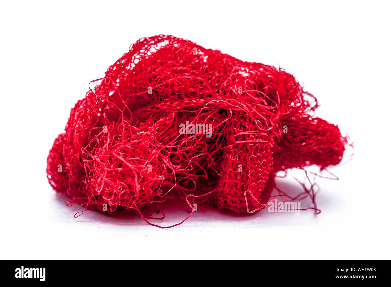 Red colored plastic scrub or scrubber used to clean vessels or utensils ...